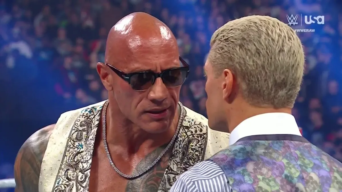 The Rock makes a surprise appearance on Raw, whispers something to Cody ...